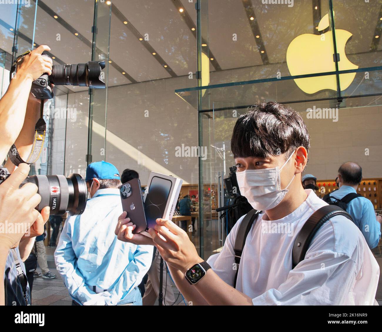 Tokyo, Japan. 16th Sep, 2022. A customer shows off his new iPhone 14 ...