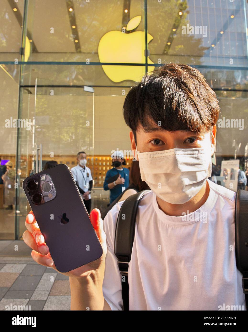 Tokyo, Japan. 16th Sep, 2022. A customer shows off his new iPhone 14 ...