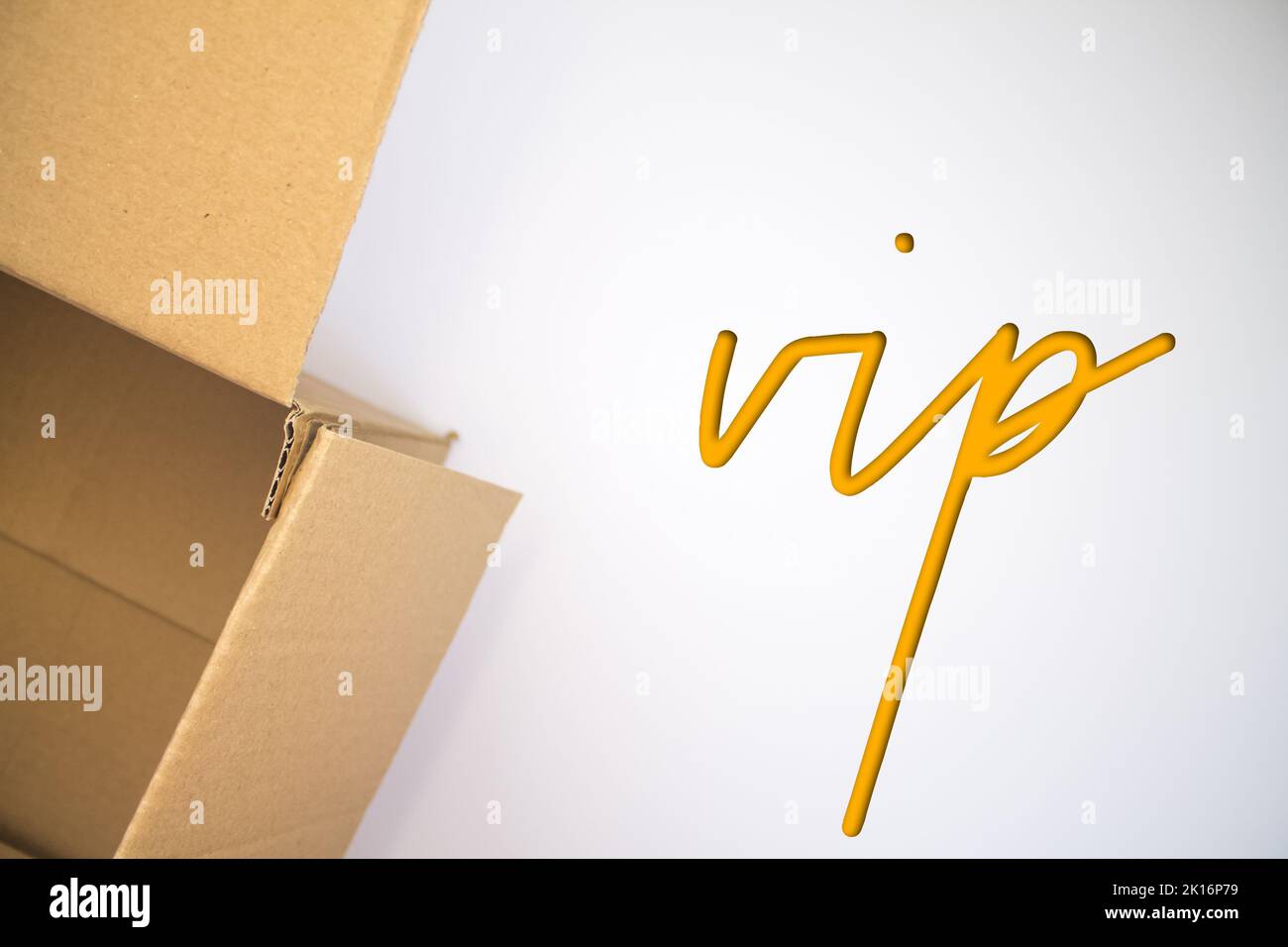 VIP word with cardboard box. Brown folded card box Stock Photo - Alamy