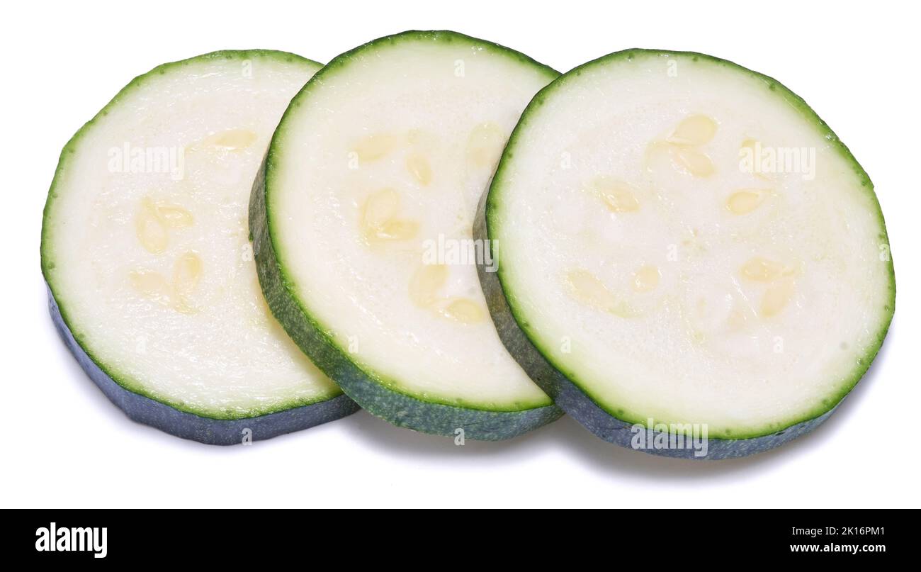 Sliced zucchini circles isolated on white background Stock Photo - Alamy