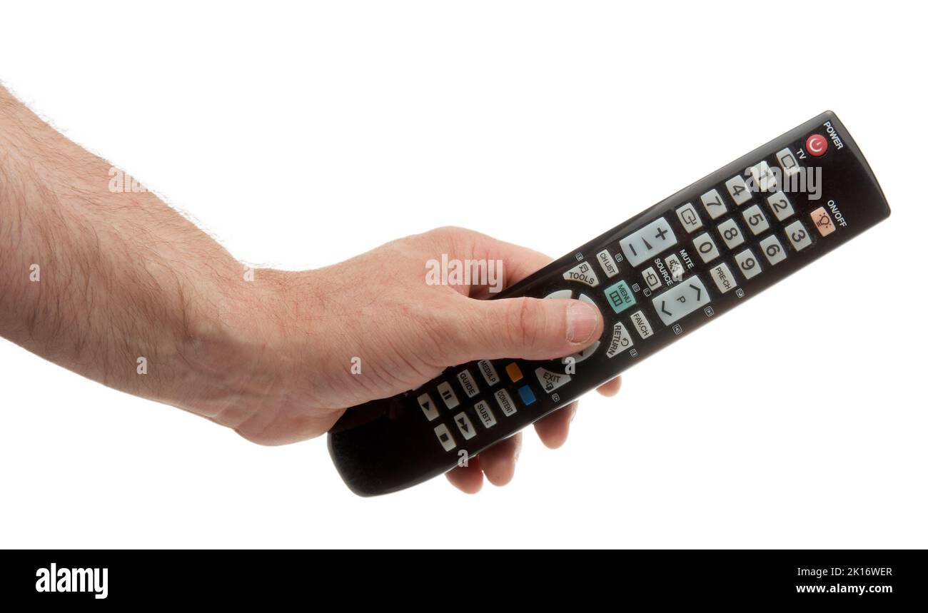 Changing TV program: close up of human hand holding television remote ...