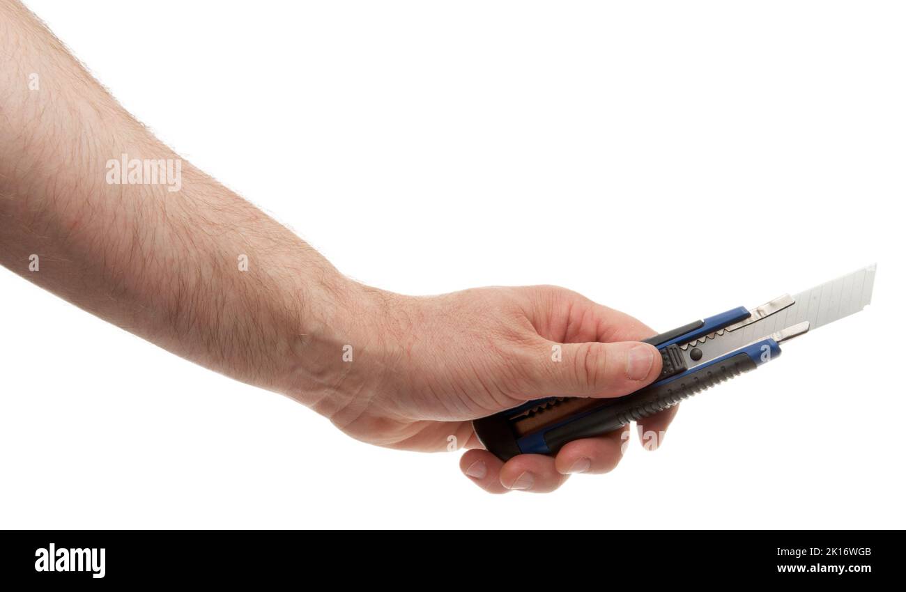 Cutter in the hand of a man isolated on a white background with ...