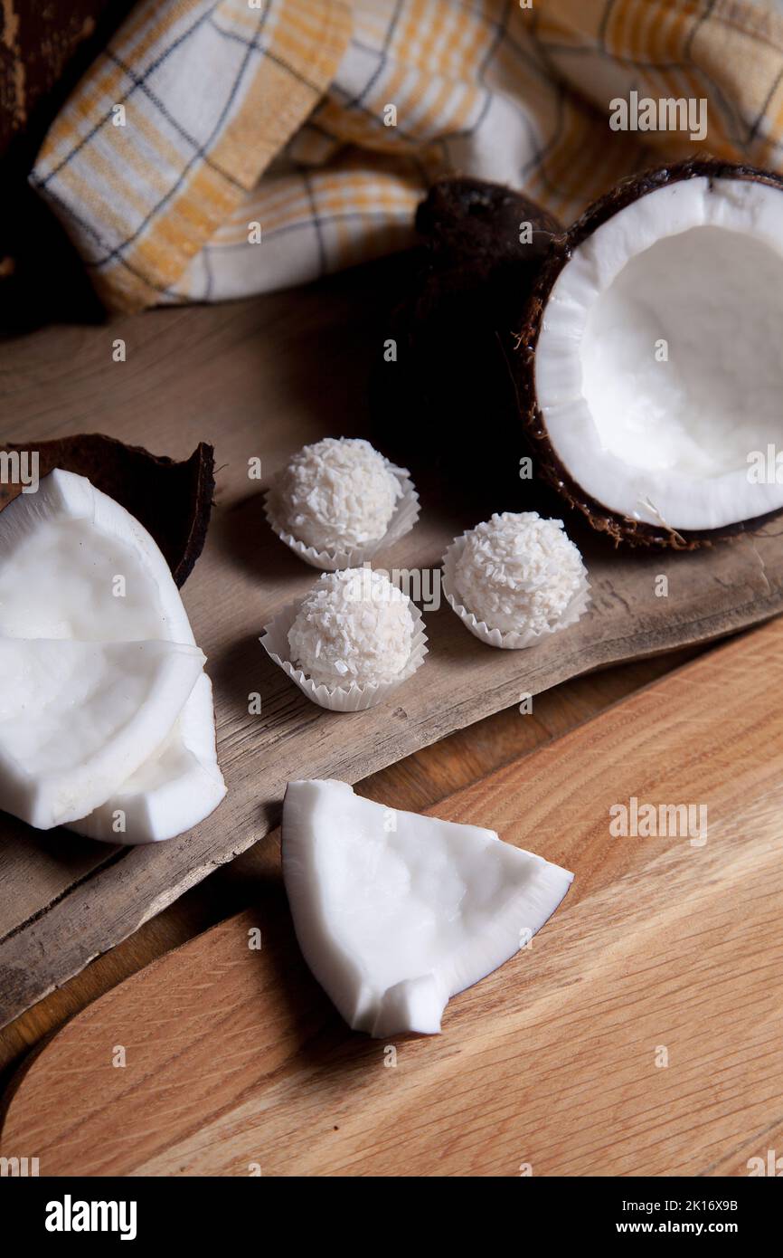 Coconut and sweet chocolate coconut truffles. Coconut shell, coconut ...