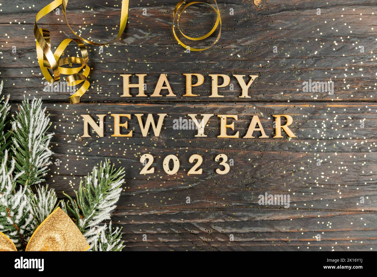 Happy New Year 2023. Quote made from wooden letters and numbers 2023 on ...