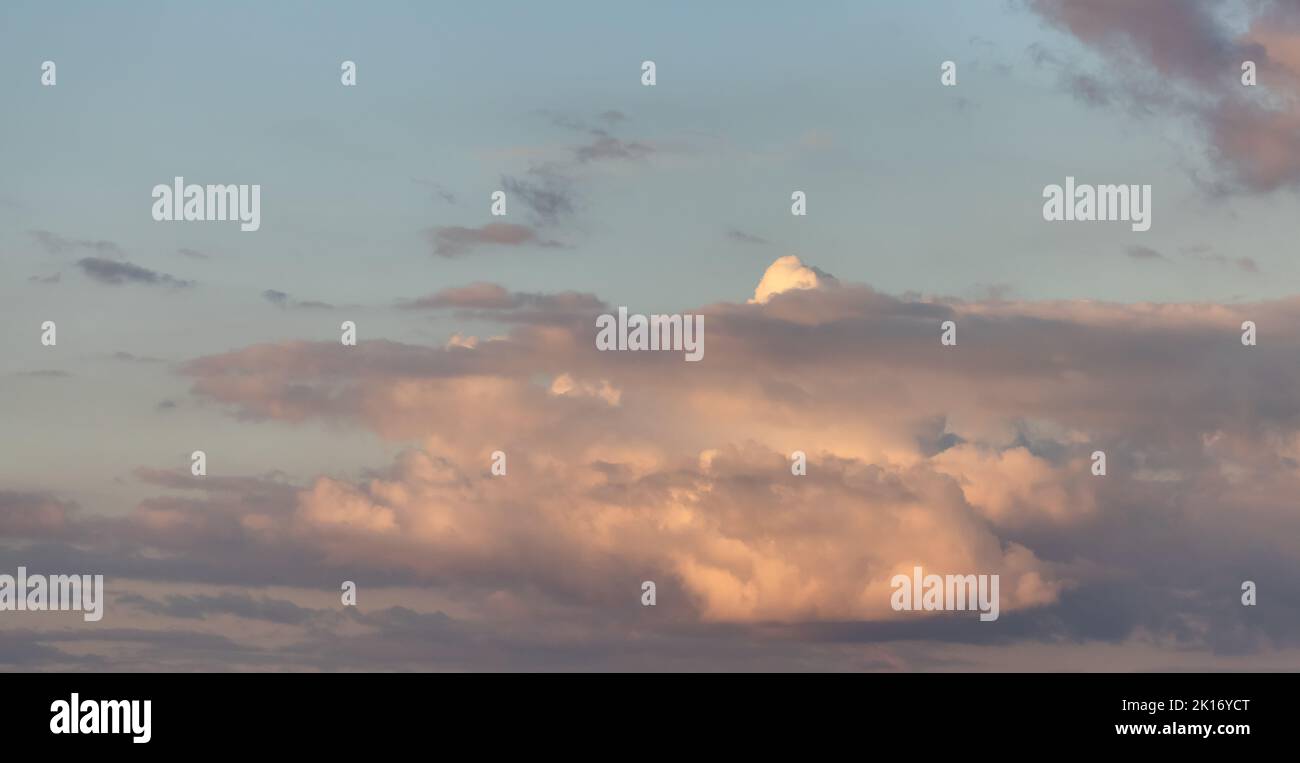 Puff Clouds in the Sky during sunset. Zoom in Stock Photo - Alamy