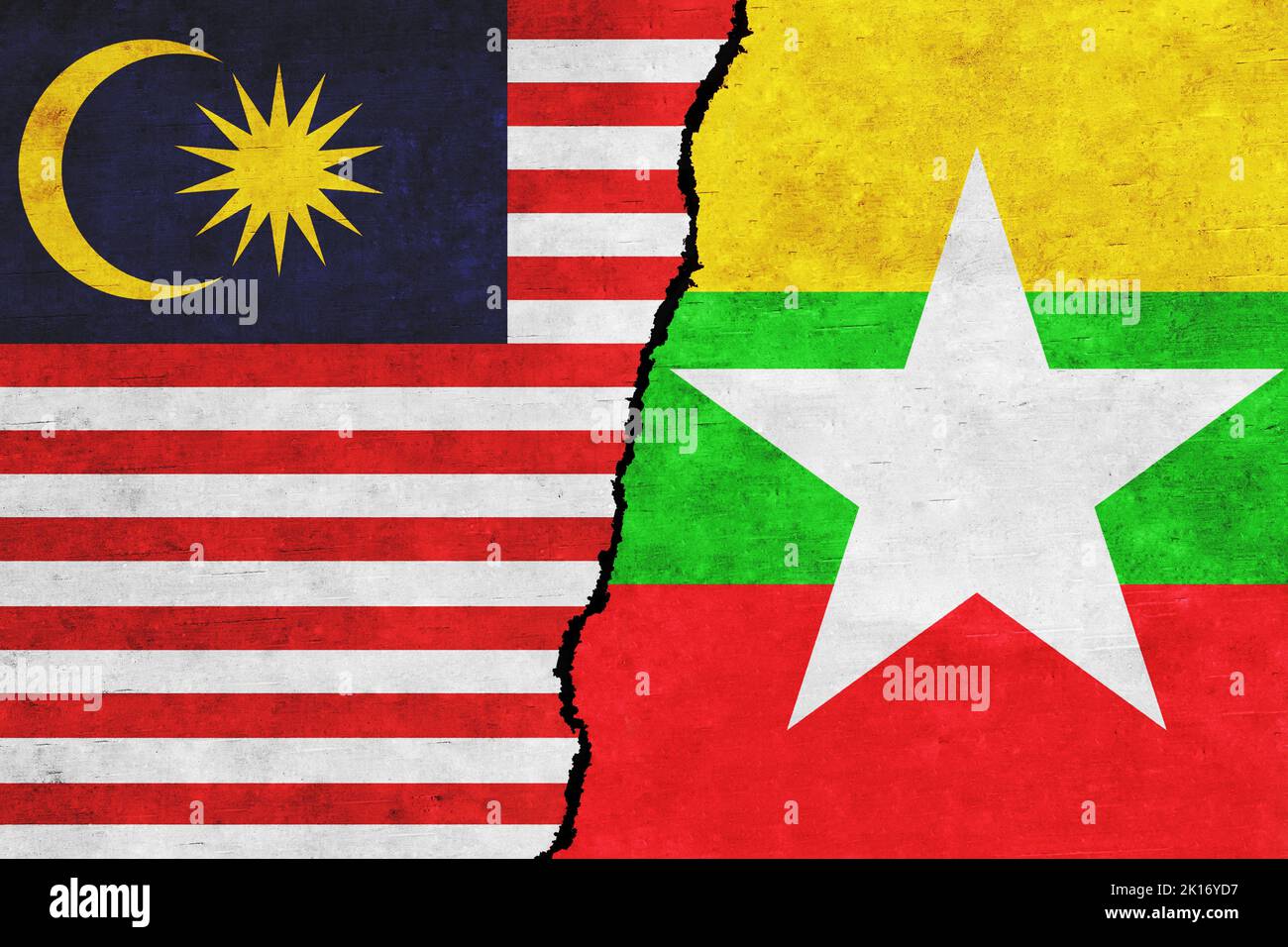 Myanmar and Malaysia painted flags on a wall with a crack. Myanmar and ...