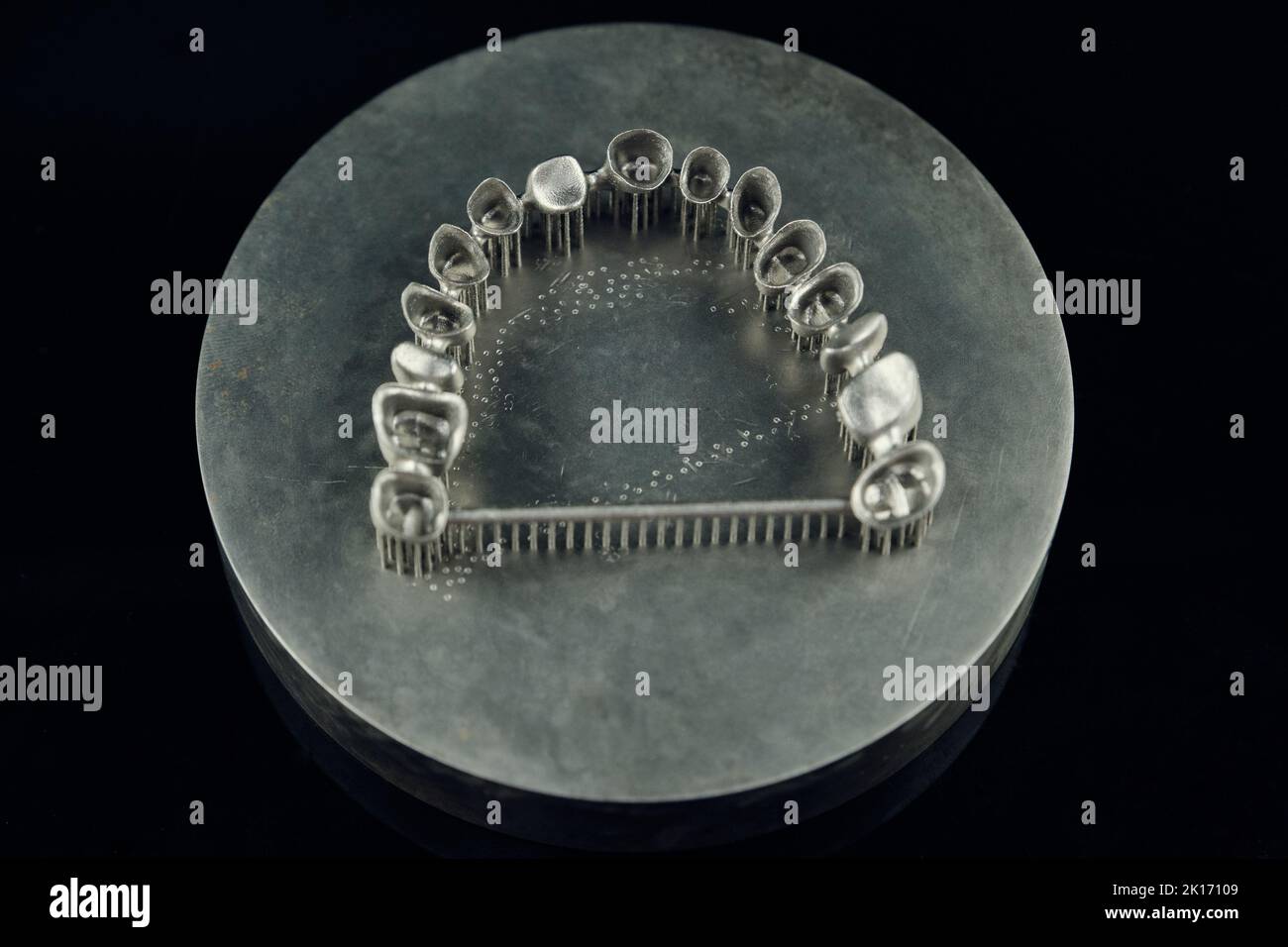 Close-up studio shot on milled metal frame for dental implants on the ...