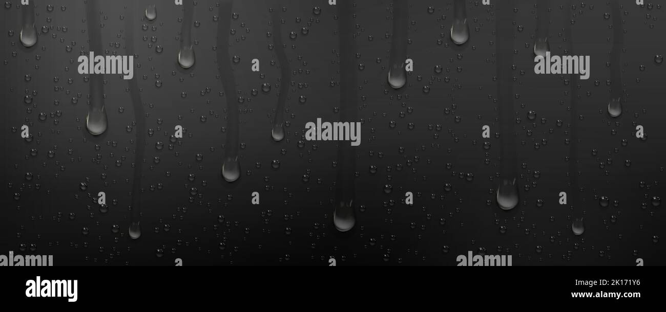 Condensation water drops with wet trails on black glass background. Sliding rain droplets on ...