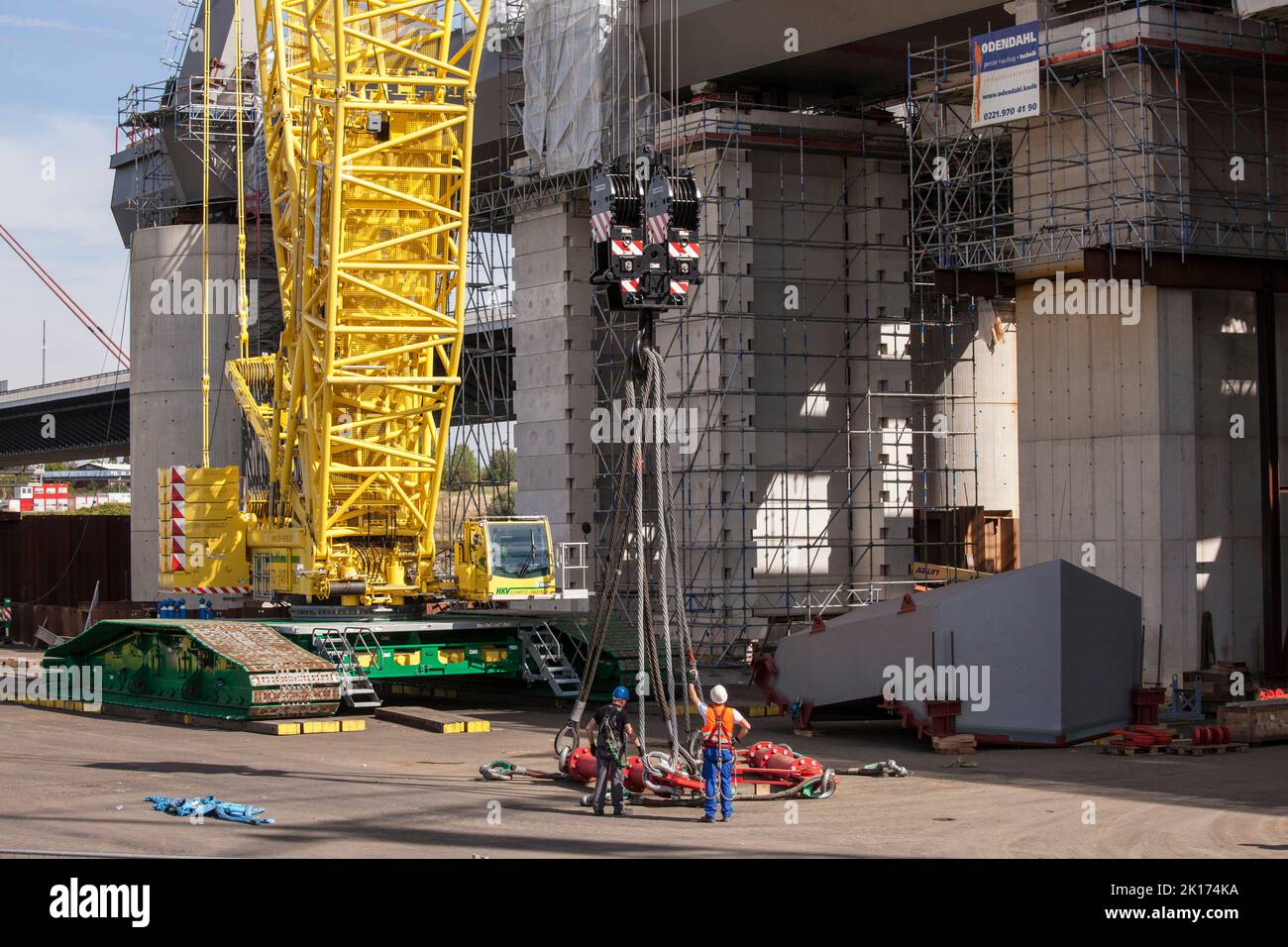 mounting a traverse for heavy load on a crane hook on the construction ...