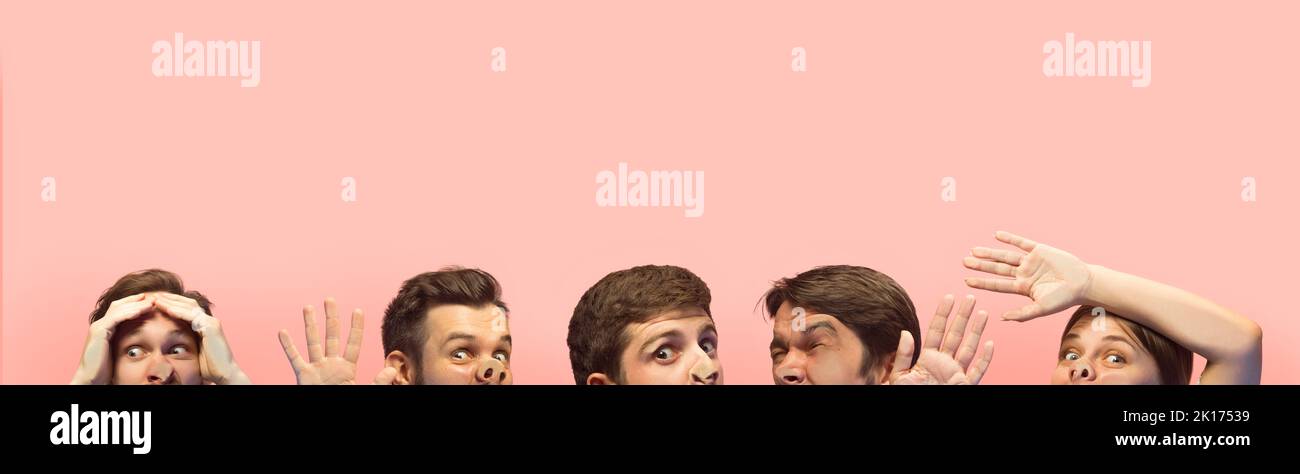 Flyer with shocked faces of young men peeking out isolated over pink ...