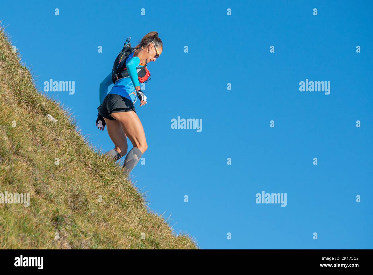 Girl running on the mountain peaks Stock Photo - Alamy