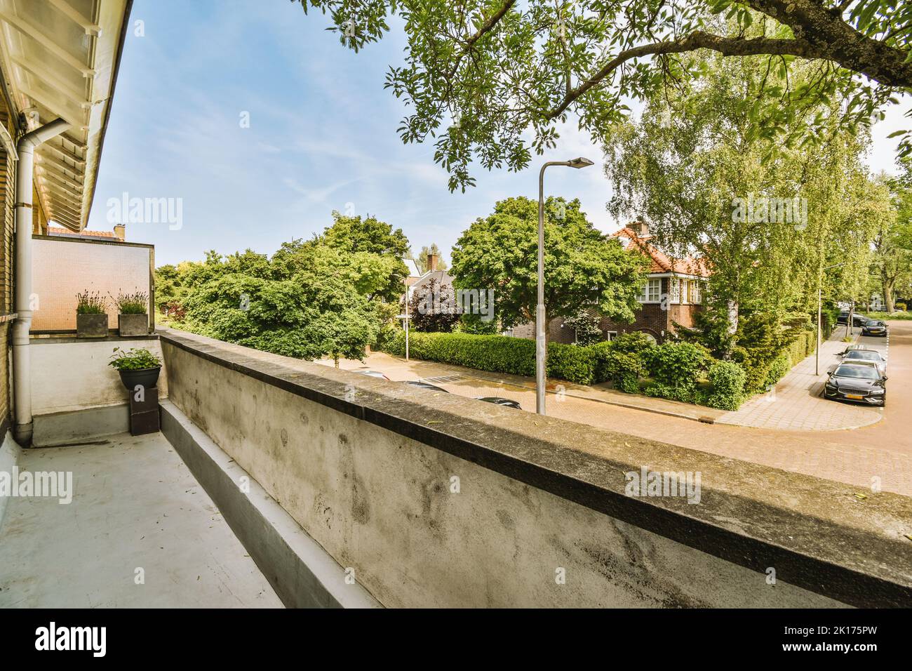 Bright brick balcony with metal railings and door Stock Photo - Alamy