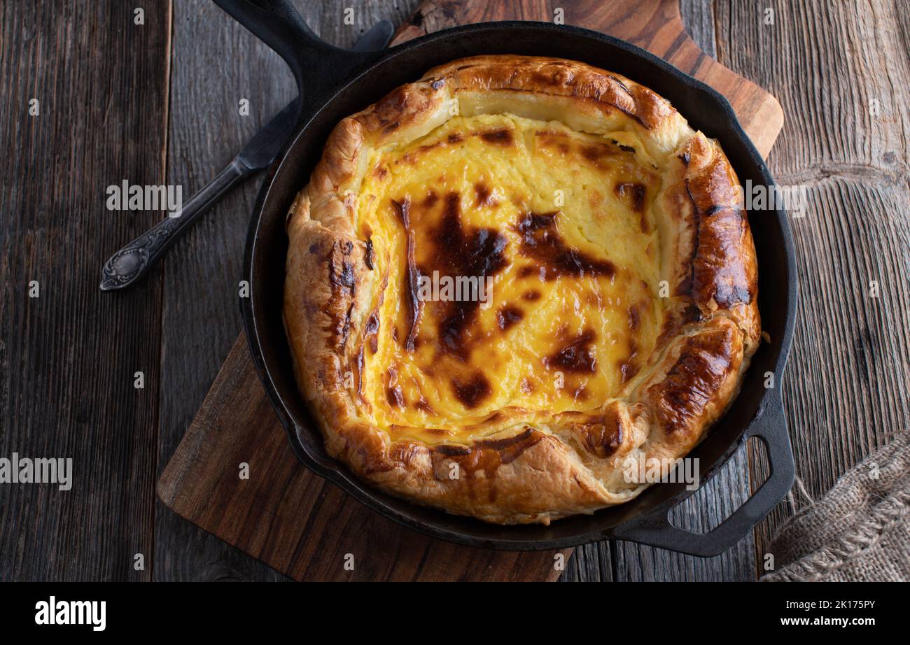 Puff pastry tart with curd lemon filling baked in a cast iron pan Stock ...