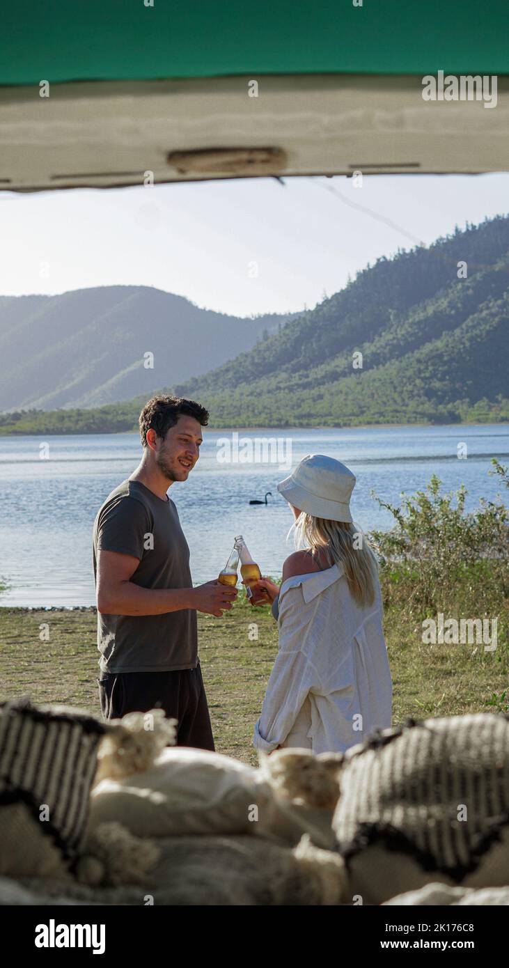 A couple at Lake Proserpine in Queensland, Australia. They have parked ...