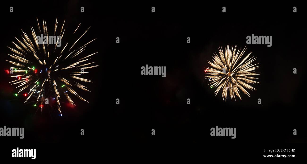 Two fireworks in night sky Stock Photo - Alamy