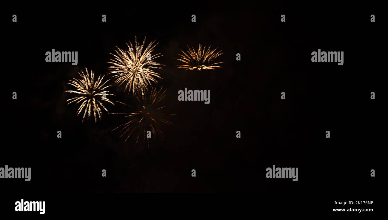 Three fireworks in night sky Stock Photo - Alamy