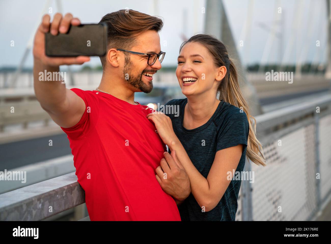 Fitness, sport, technology and lifestyle concept. Two smiling people ...