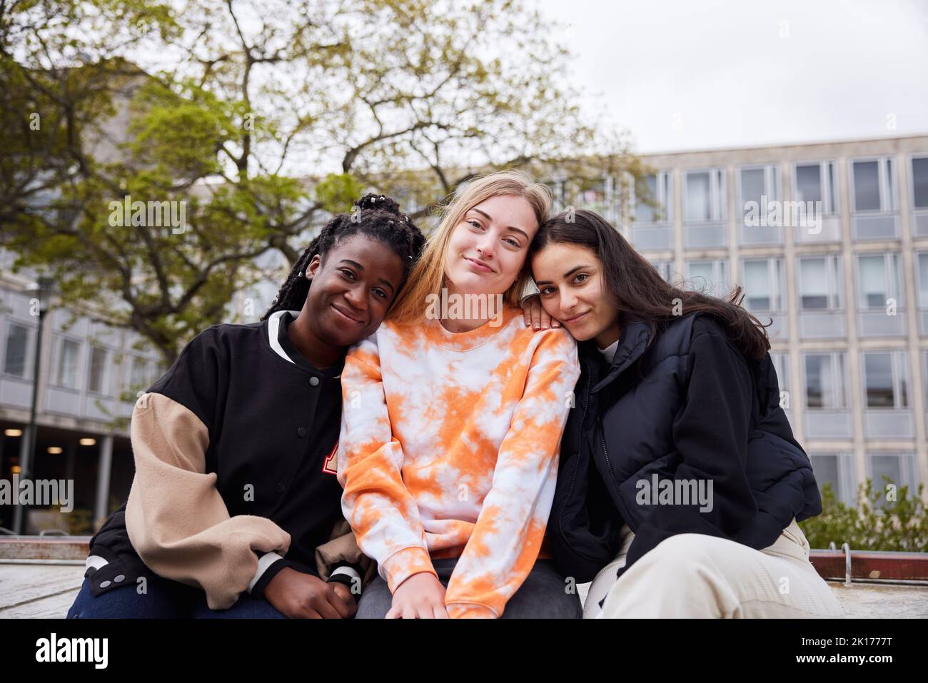 Three young female students at campus Stock Photo - Alamy