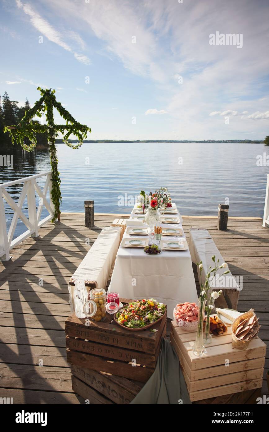 Table and food at lake Stock Photo - Alamy