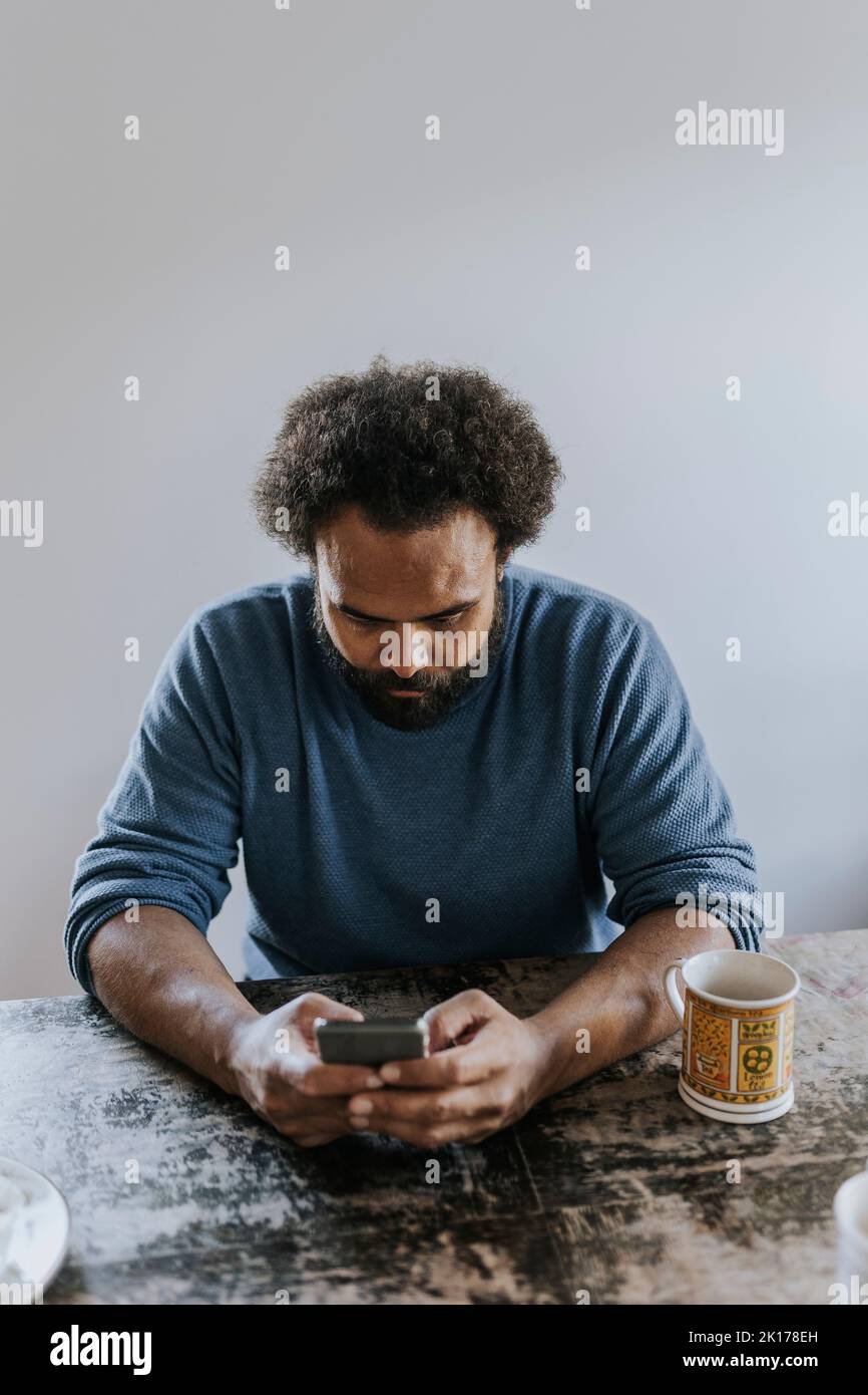 Sick man sitting table hi-res stock photography and images - Alamy