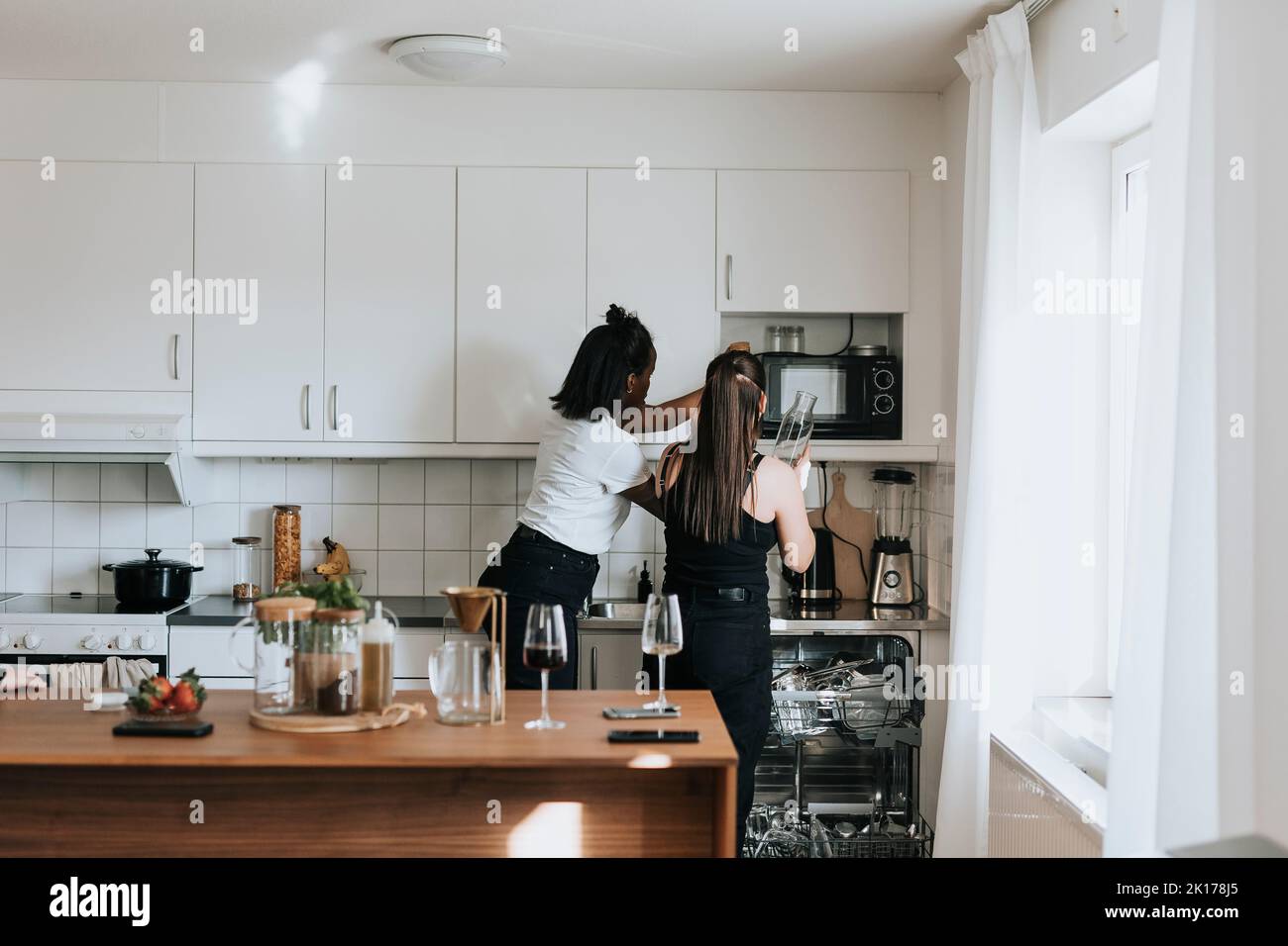 Women in kitchen Stock Photo - Alamy