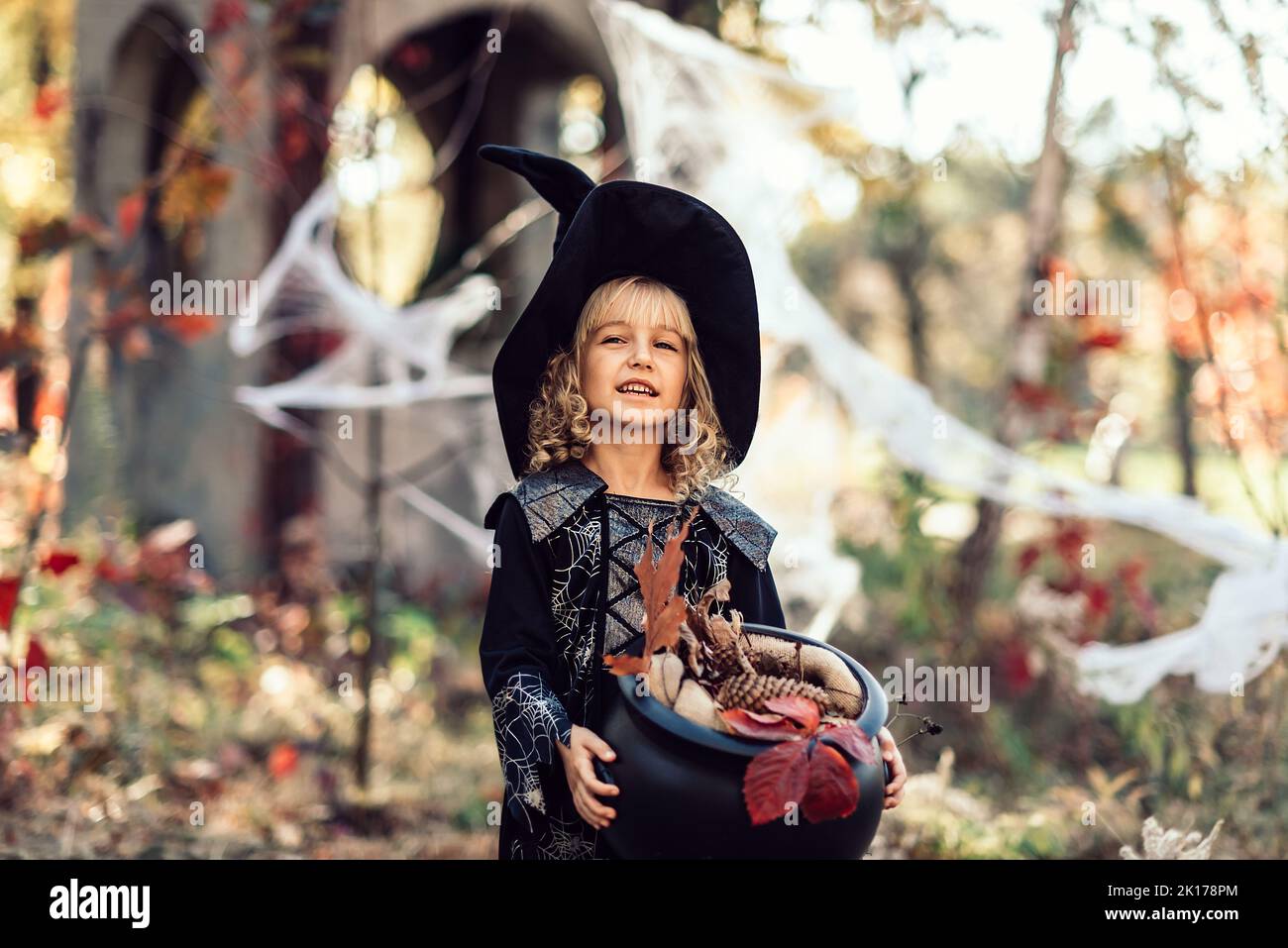 Beautiful girl witch. little girl in which costume celebrate Halloween ...