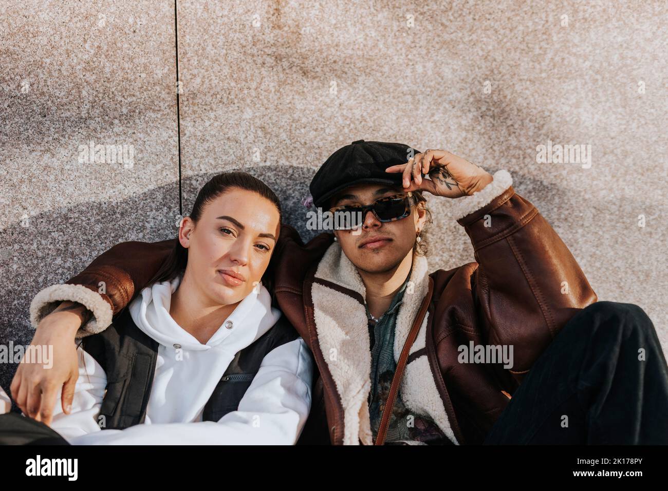 Smiling friends looking at camera Stock Photo - Alamy
