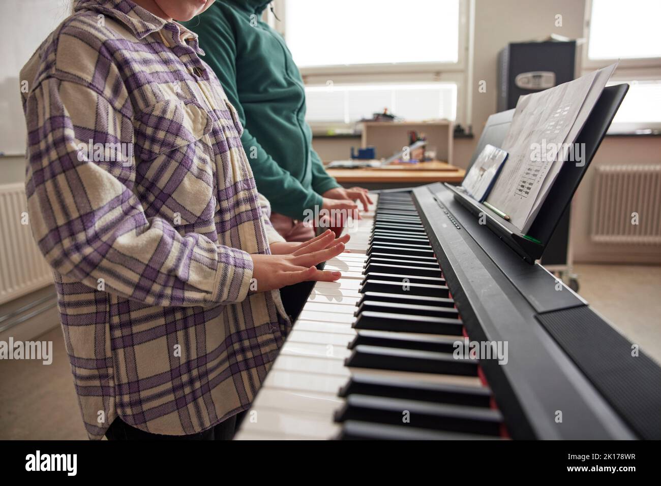Children playing keyboard instrument Stock Photo - Alamy