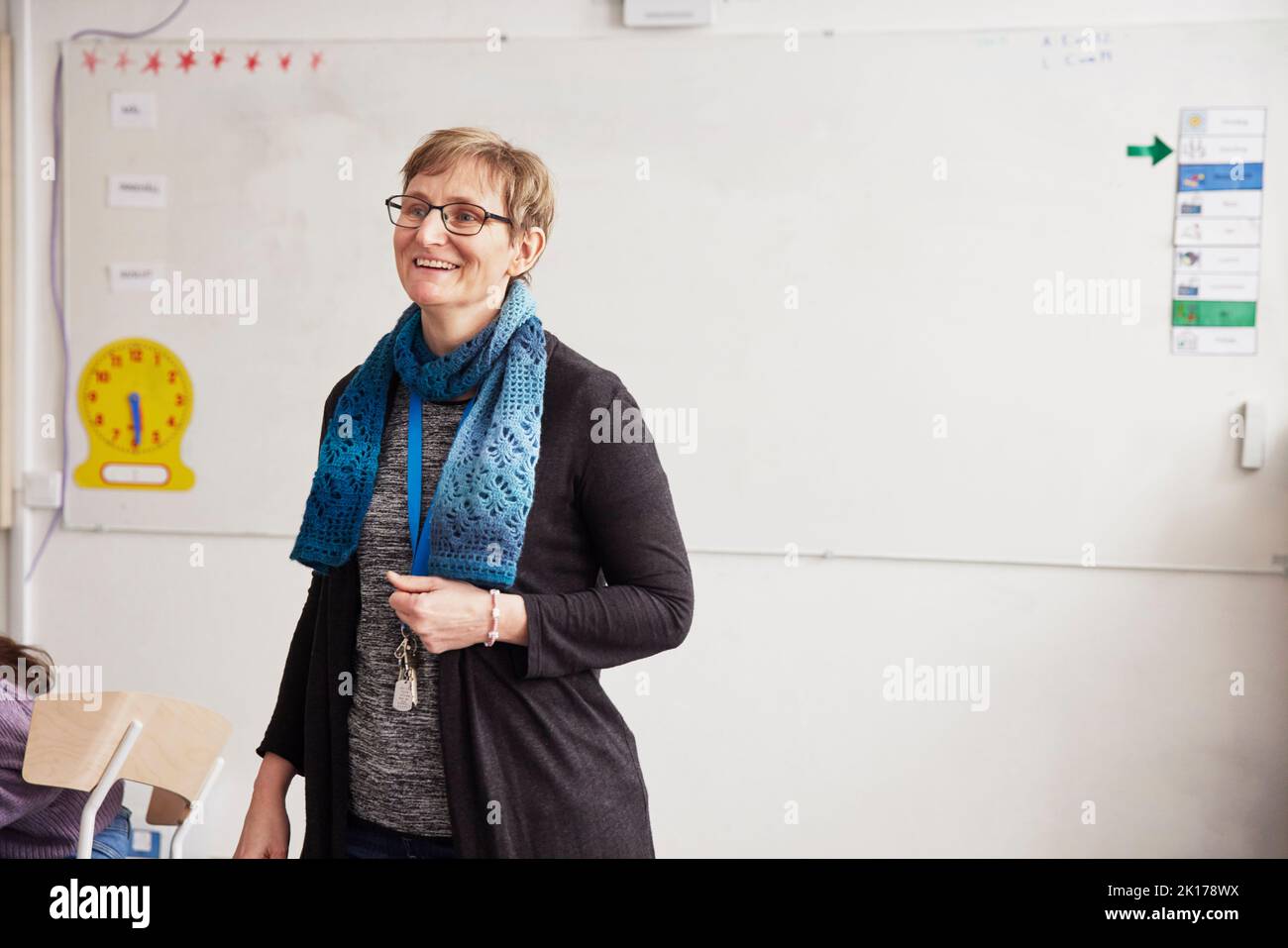 Teacher standing front whiteboard hi-res stock photography and images ...