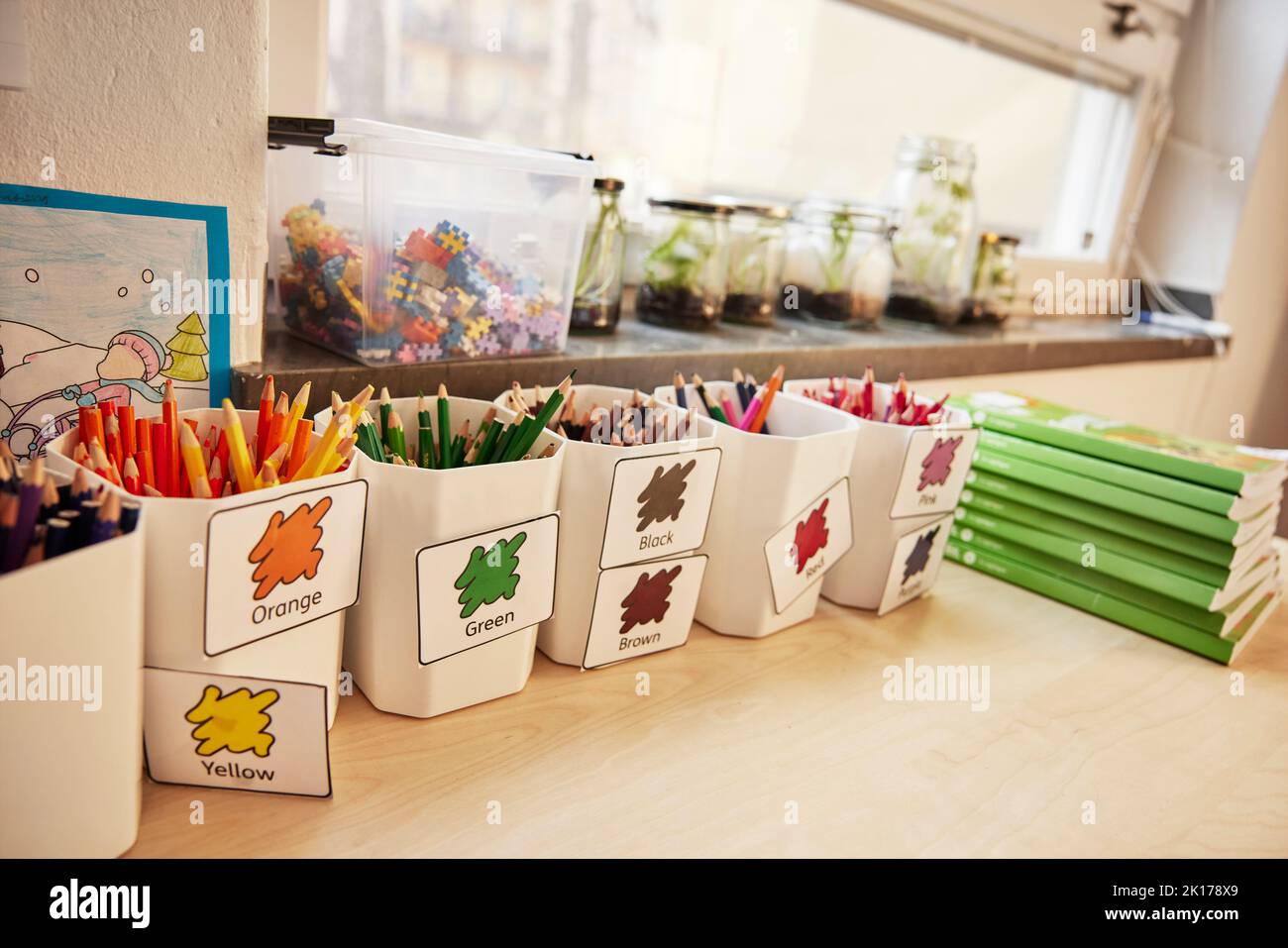 Crayons in plastic containers Stock Photo - Alamy