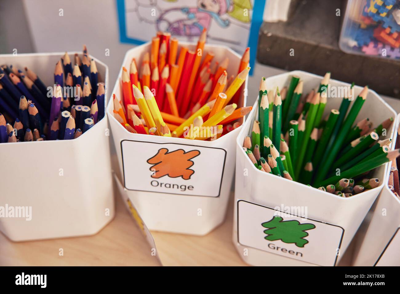 Crayons in plastic containers Stock Photo - Alamy