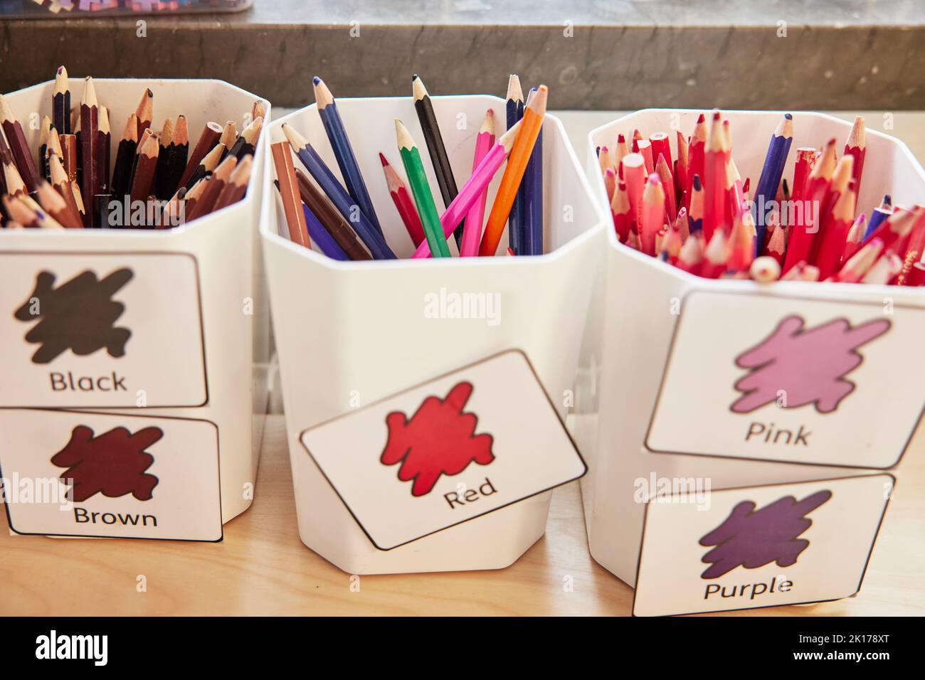 Crayons in plastic containers Stock Photo - Alamy