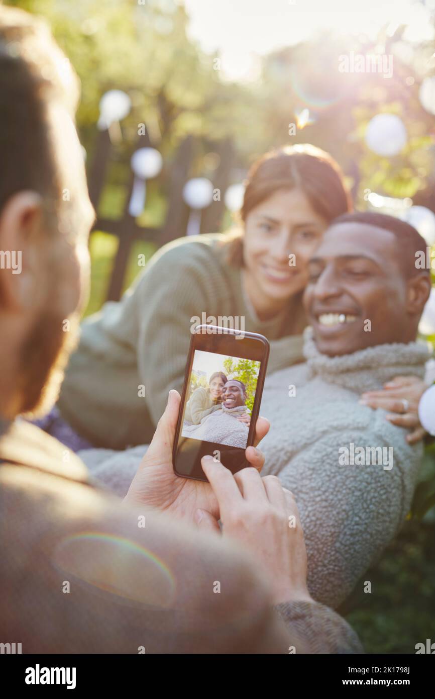 Hand with cell phone taking picture Stock Photo - Alamy