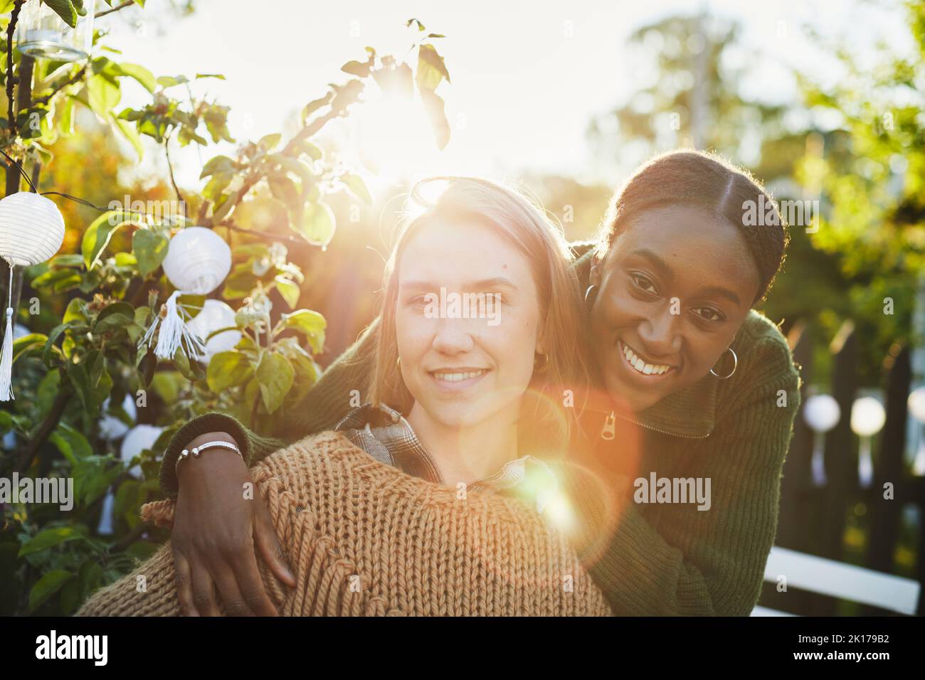 Female friends looking at camera Stock Photo - Alamy