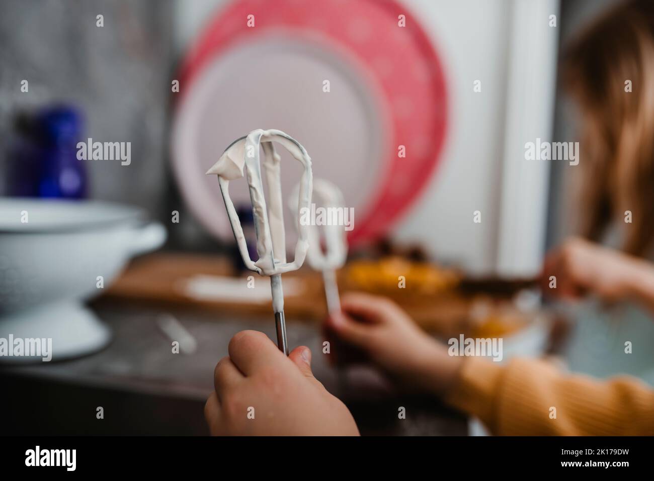 Hand holding whisk Stock Photo - Alamy