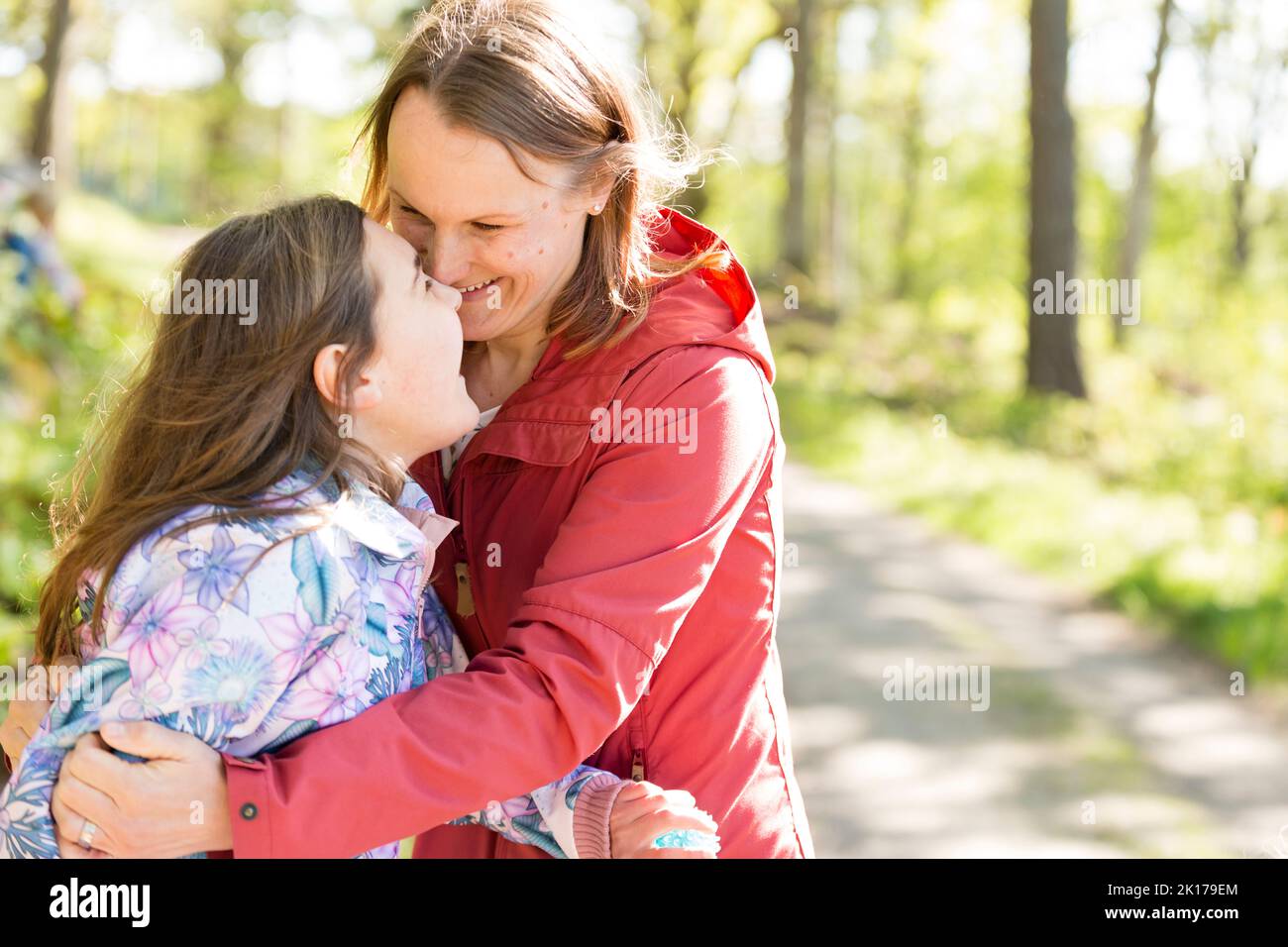 Positive mother standing daughter hi-res stock photography and images - Alamy