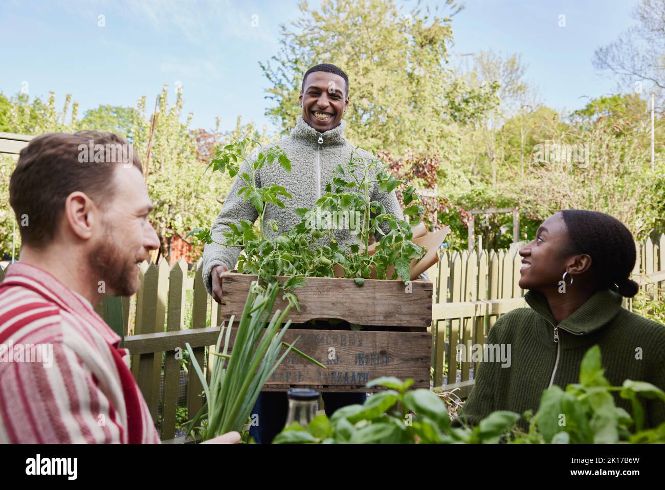 Happy friends gardening hi-res stock photography and images - Alamy