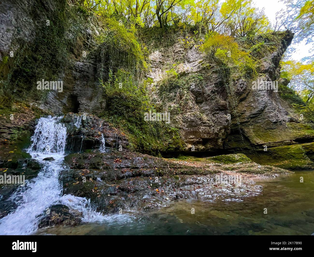 Mossy canyon with clean waterfall Stock Photo - Alamy
