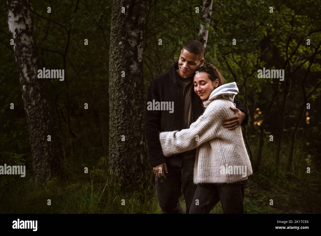 Couple hugging in forest hi-res stock photography and images - Alamy