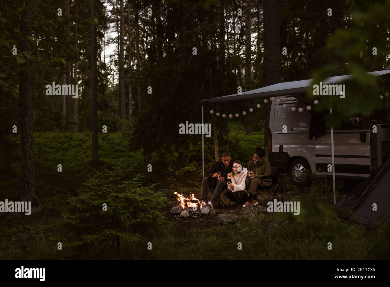 Friends camping woods hi-res stock photography and images - Alamy
