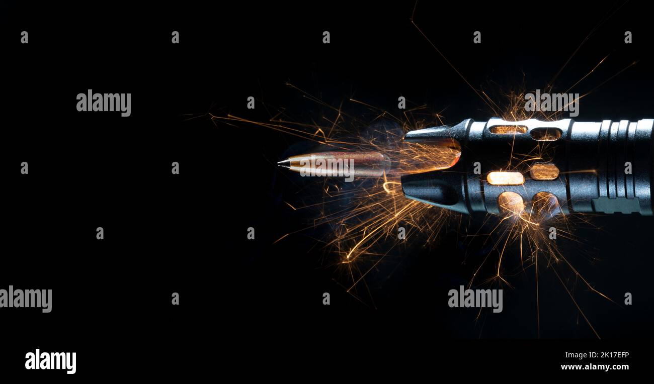 Copper plated bullet with smoke and sparks leaving the barrel of an AR ...