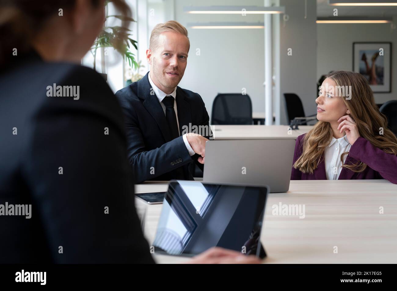 Business people having meeting in office Stock Photo - Alamy