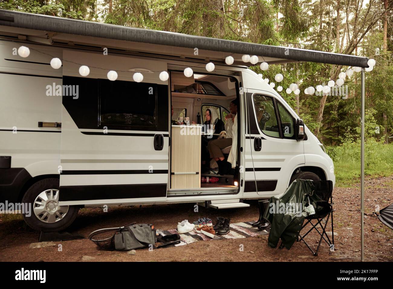 Camper van parked in forest Stock Photo - Alamy
