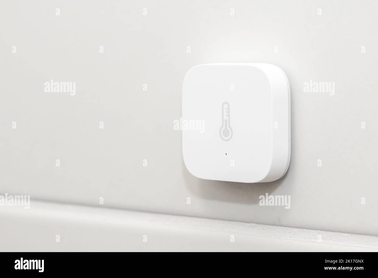 Smart heat sensor on the white wall Stock Photo - Alamy