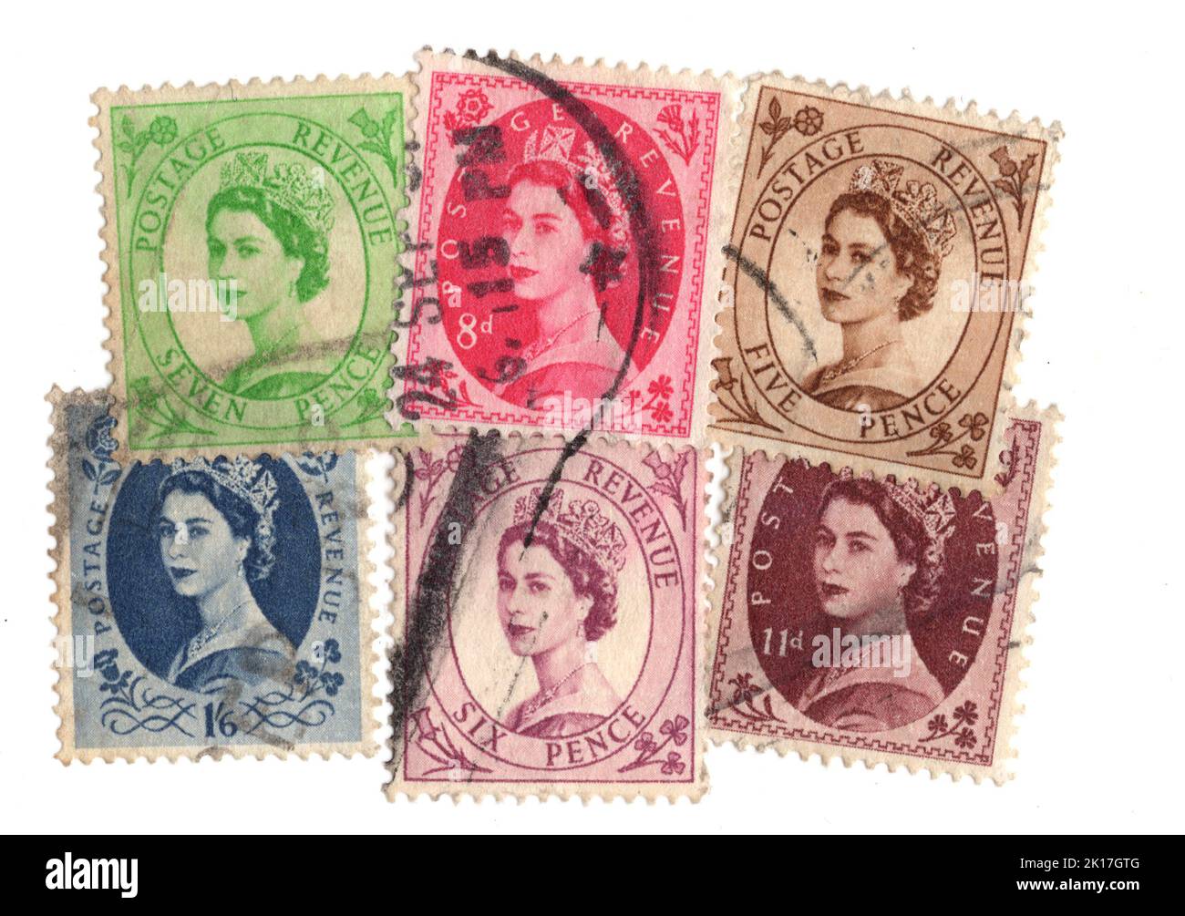 A montage of Queen Elizabeth II stamps from Great Britain on a white ...