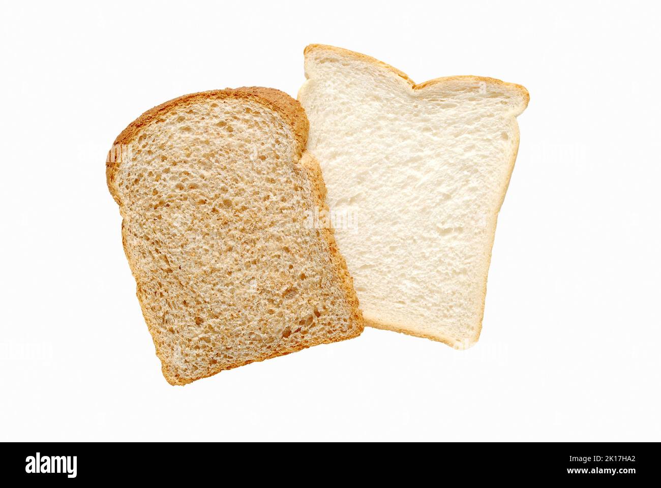Two pieces of sliced bread, one white one brown wholewheat on white ...