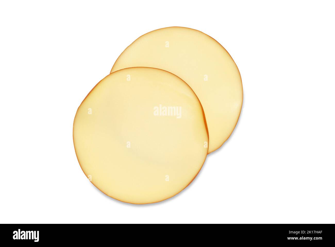 Two pieces of sliced Bavarian smoked cheese isolated on white ...