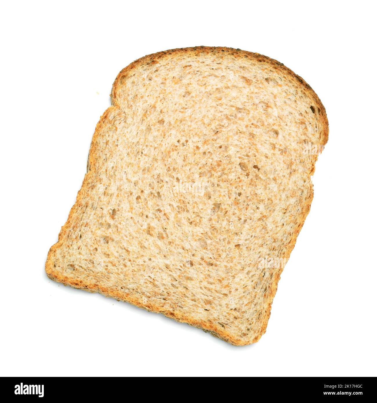 Single slice of wholemeal brown bread shot from above on white ...
