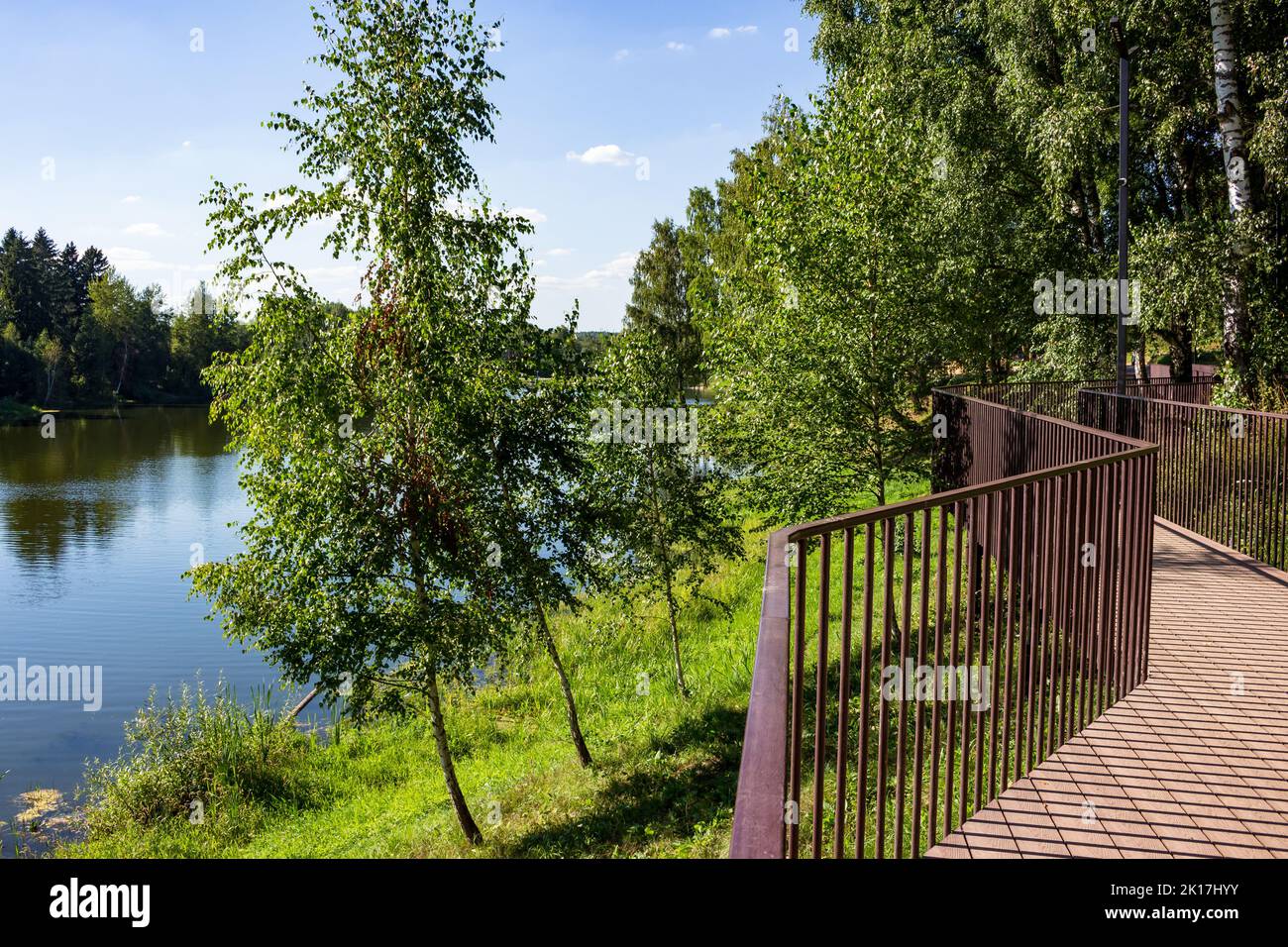 A beautiful promenade overlooking the lake, wooden walkways with ...