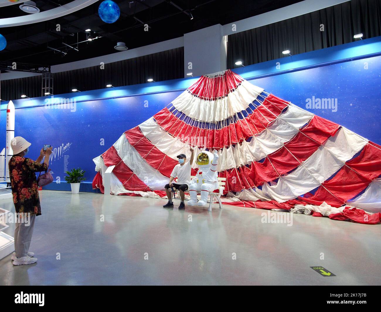 BEIJING, CHINA - SEPTEMBER 16, 2022 - Spectators pose in front of ...